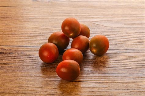 Premium Photo | Cherry Kumato black juicy tomato