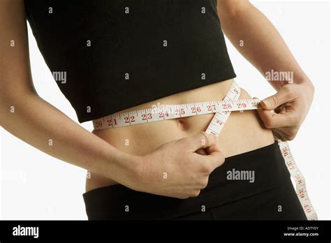 Measuring a waist-line Stock Photo - Alamy