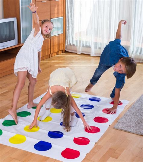 Children Playing at Twister Stock Photo - Image of floor, childhood ...