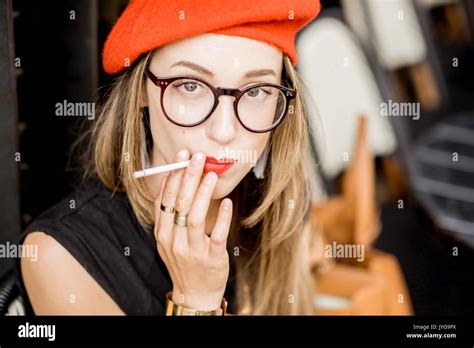French woman smoking at the cafe Stock Photo - Alamy