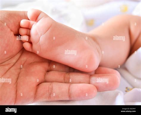Baby feet newborn Stock Photo - Alamy