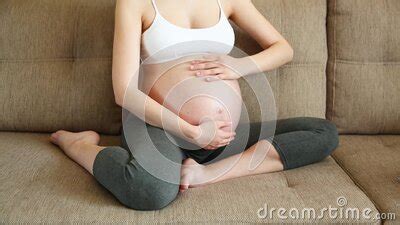 Close-up of the Pregnant Woman ScrClose-up of the Pregnant Woman in Underwear Scratching Her ...