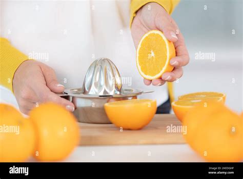 Man squeezing orange juice hi-res stock photography and images - Alamy