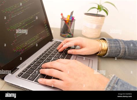 Programming Work Time. Programmer Typing New Lines of HTML Code. Laptop ...