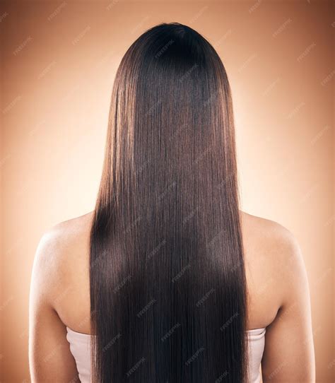 Premium Photo | Back straight hair and beauty of woman in studio ...