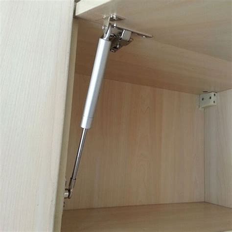 Газовый лифт для шкафа 92 фото