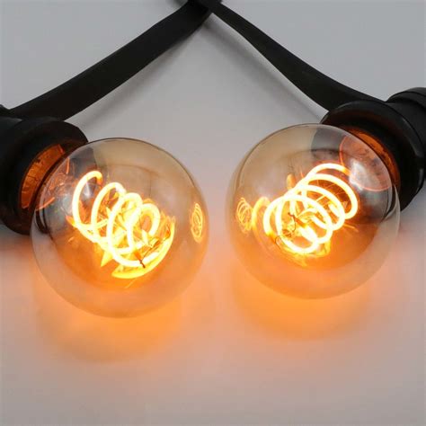 Set of festoon lights with 4W DNA spiral filament bulbs in amber glass ...