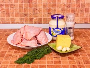 Куриные бедрышки, запеченные с сыром