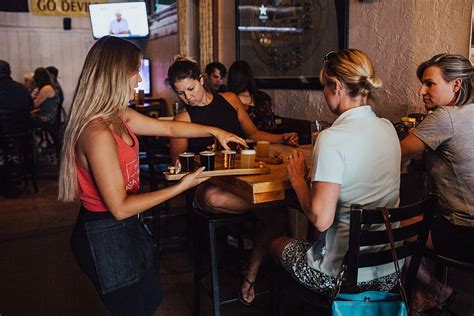 woman, serving, drinks, women, sitting, inside, establishment, bar ...