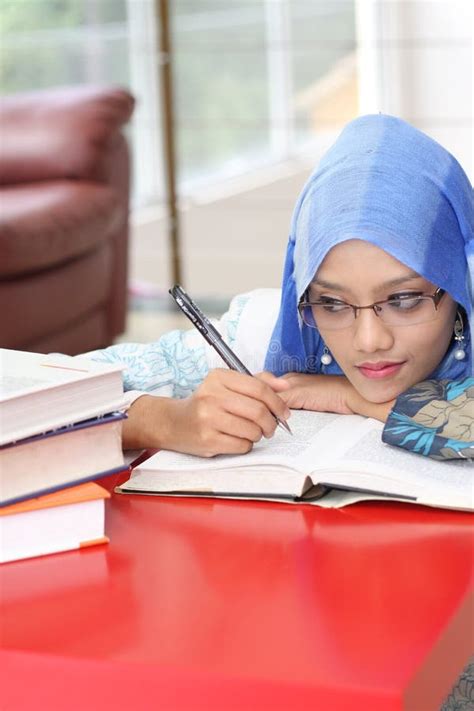 Muslim woman with a book stock photo. Image of asia, classroom - 19685158