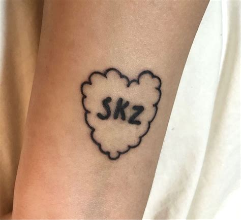 a person with a tattoo on their arm that has the word sk2 in it