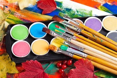 Paints and brushes — Stock Photo © VIZAFOTO #90827372