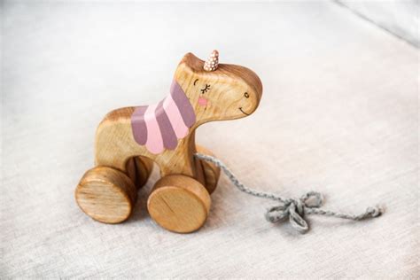 Деревянная игрушка каталка на веревочке Единорог | Лес домой