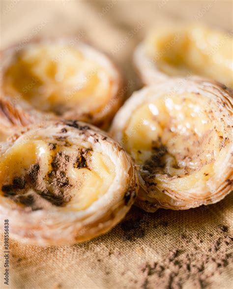 Pasteis de nata on yellow backdrop Stock-Foto | Adobe Stock