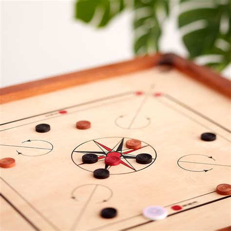 Discover The Ancient Game of Carrom - Uber Games