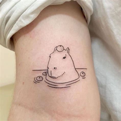 a person with a small tattoo on their leg