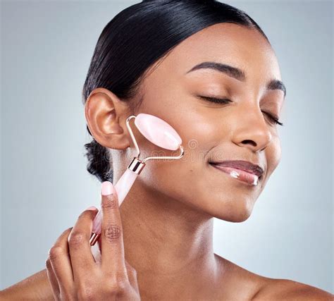 Face Roller, Beauty and Woman in Studio for Skin Care, Wellness and ...