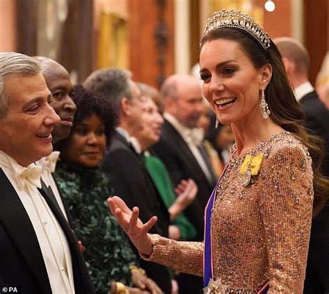 King and Queen are joined by Prince William and a dazzling Kate Middleton as they put on a ...
