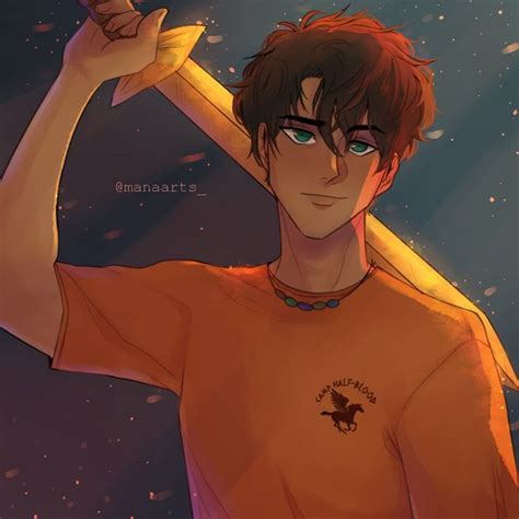 a young man with glasses and an orange t - shirt holds his arm up in ...