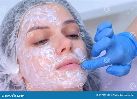 Cosmetologist is Applying Cream with Anesthesia on Patient`s Face ...