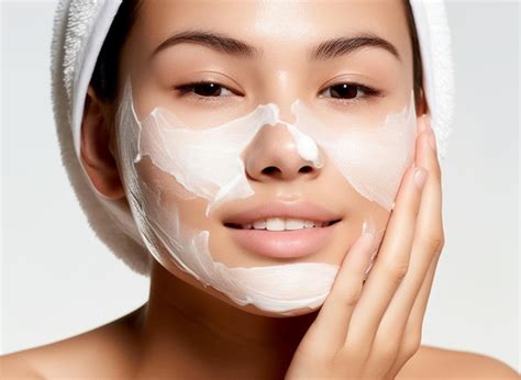 Premium AI Image | Asian young woman applying sunscreen on her face ...