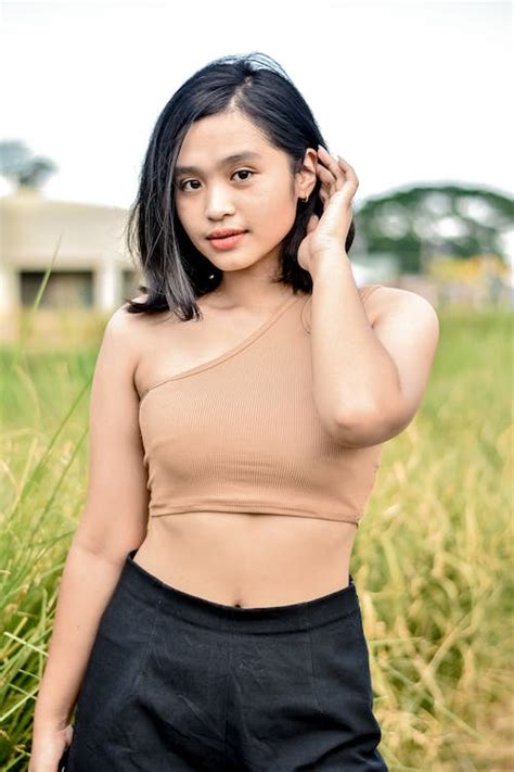 Girl Wearing Brown Tank Top · Free Stock Photo