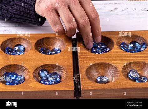 Mangala game board and glass marbles. Historical Turkish game mangala ...