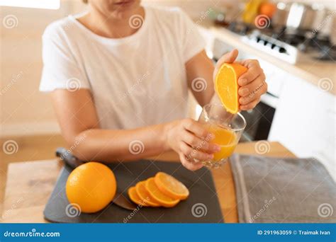 Women S Hands Squeezing Juice Out of Oranges. Stock Image - Image of vitamins, organic: 291963059