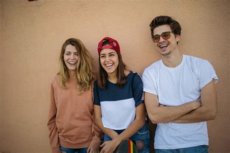 Three Friends Posing Outdoors Stock Photo - Download Image Now - Adult ...