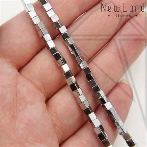 Гематит куб серебристый 3 мм 1/2 нити > NewLand-furnitura