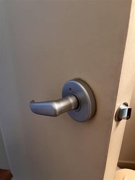 How to tighten this type of door handle. : r/fixit