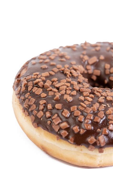 Chocolate Donut in the hand with copy space - Creative Commons Bilder