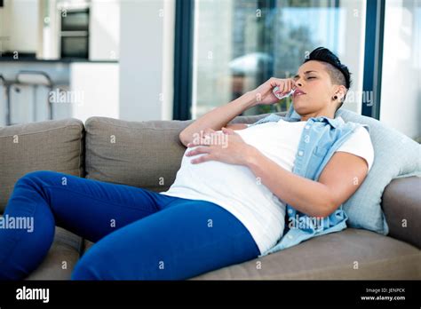 Pregnant sleeping on sofa hi-res stock photography and images - Alamy