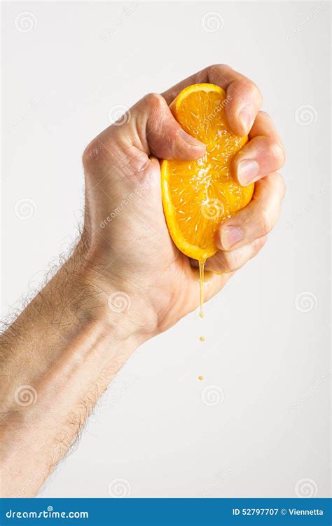 Man S Hand Squeezing an Orange Half Stock Image - Image of vertical, fingers: 52797707