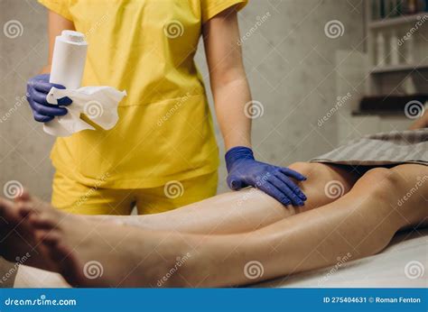 Beautician Waxing Female Legs in Spa Center. Stock Image - Image of ...