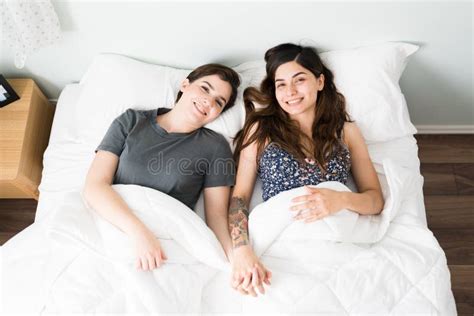 Top View of Happy LGBT Girlfriends in Bed Smiling at the Camera Stock ...