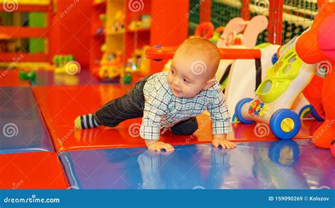 Two Years Old Child Boy Play in Indoor Kindergarten Playground Stock ...