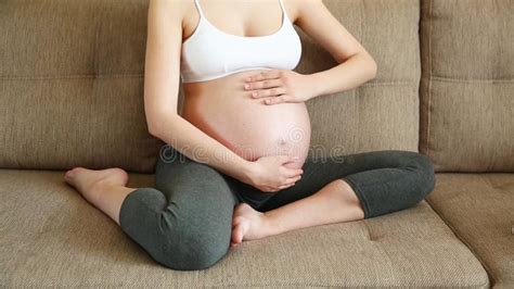 Close-up of the Pregnant Woman Stroking Her Stomach on Sofa Stock Video - Video of woman, white ...