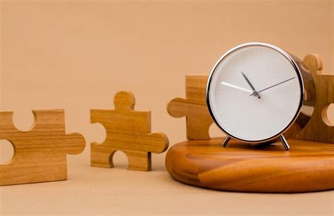 Premium Photo | Clock and jigsaw puzzle pieces time lapse time wooden ...