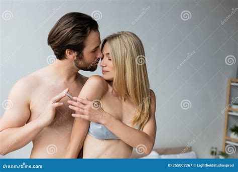 Brunette Shirtless Man Taking Bra Off Stock Image - Image of desire, lovers: 255002267
