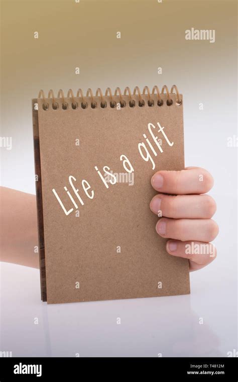 Motivational quotes wording Each dayis a gifts Stock Photo - Alamy