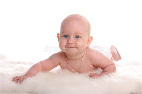 Happy baby on a soft rug stock photo. Image of months - 9100380