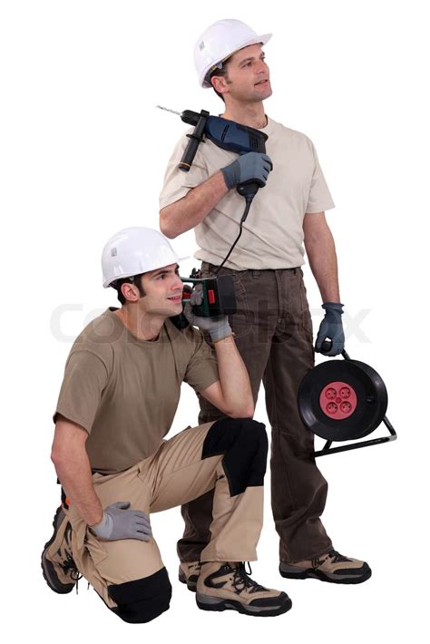 Handwerker mit ihren Werkzeugen | Stock Bild | Colourbox