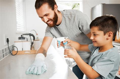 Premium Photo | Cleaning bonding and caucasian father and son working ...